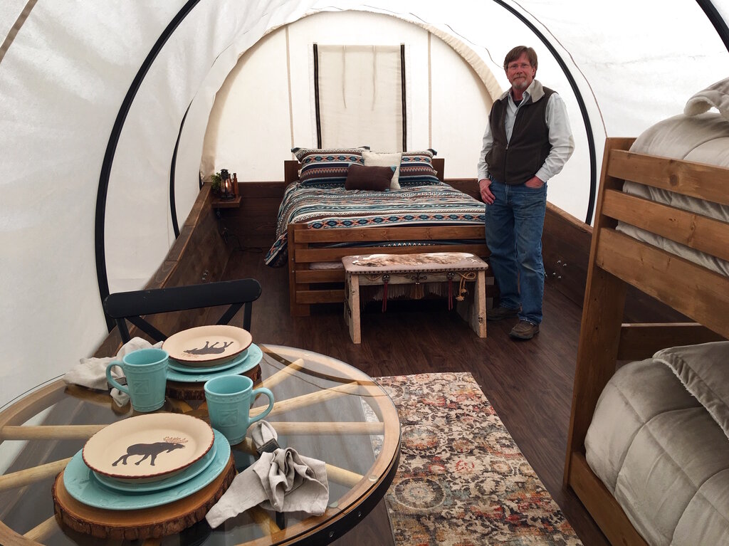 Couple designs covered wagons for 'glamping - Sentinel Colorado